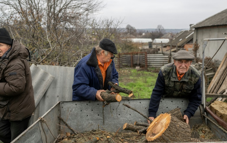 War-weary Ukraine Residents Chop Wood To 'Survive' Winter | IBTimes